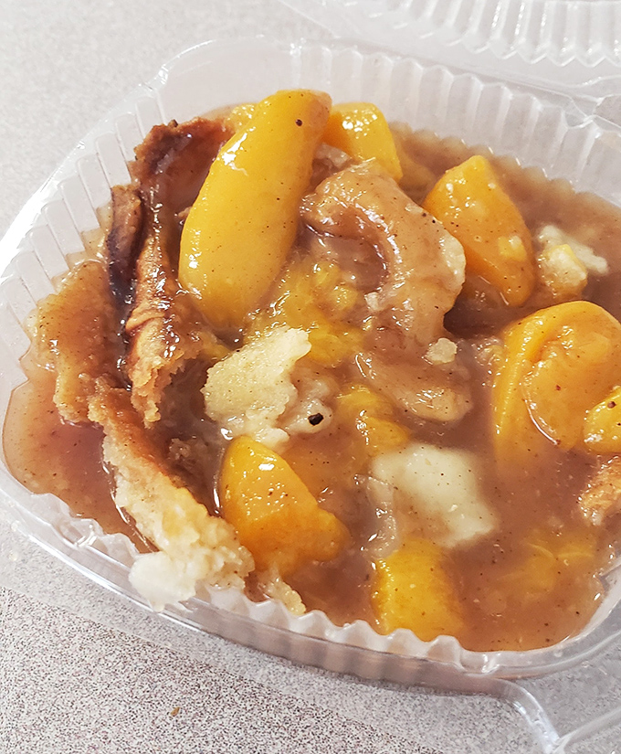 Peach cobbler that captures summer in a plastic container. The sweet-tart fruit and buttery crust create the kind of harmony that makes musicians jealous.