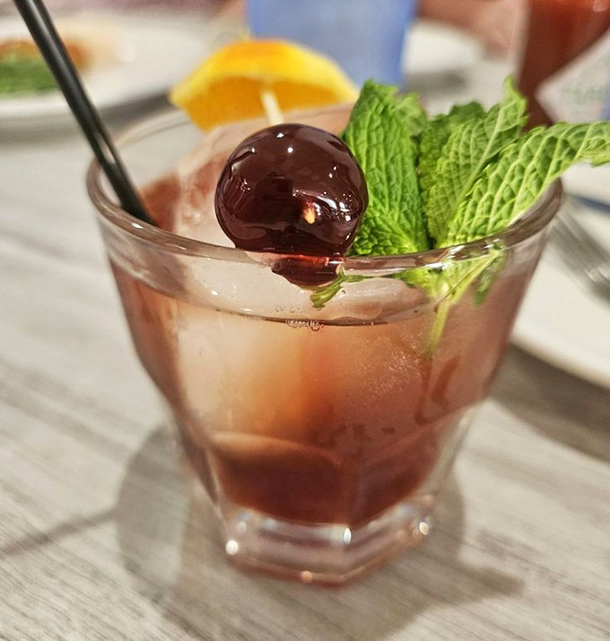 This isn't just a cocktail &ndash; it's a vacation in a glass, complete with mint leaves standing in for palm trees.