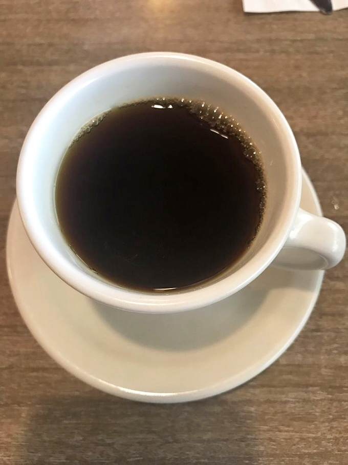 The lifeblood of diners everywhere&mdash;coffee in a sturdy white mug. No fancy latte art needed when the brew itself has character to spare.