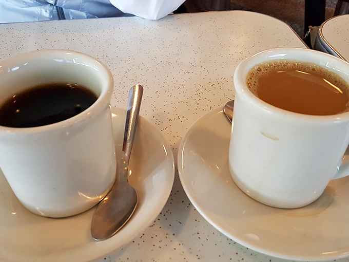 Two steaming cups of liquid comfort, because great conversations always start with great coffee.
