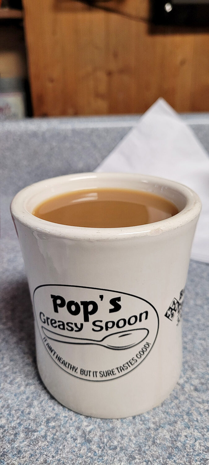 The coffee mug says it all – "It ain't healthy, but it sure tastes good" – the unofficial motto of every great American diner worth its salt.