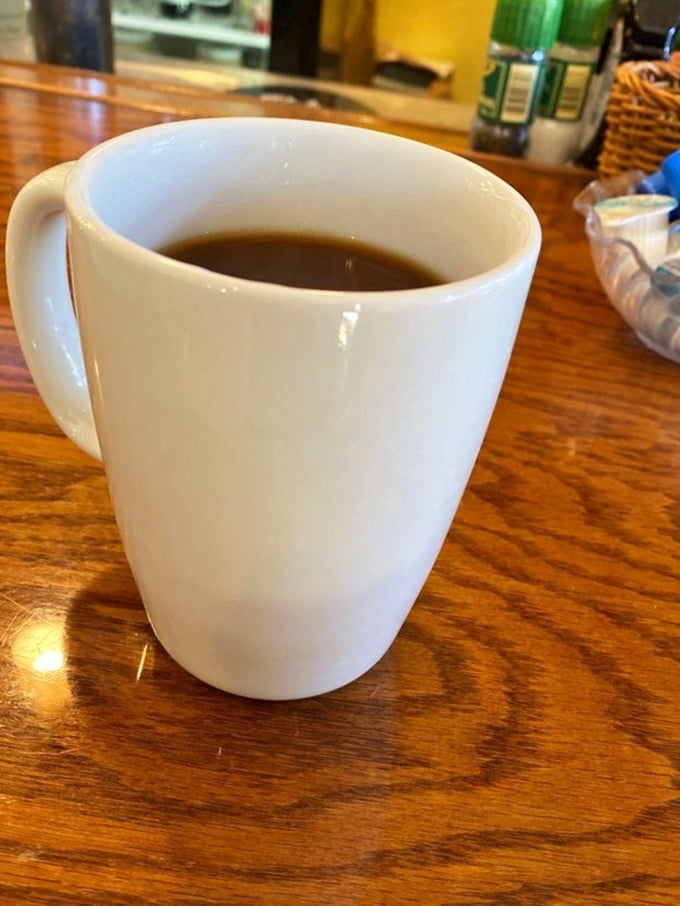 Sometimes the simplest pleasures are the most profound—a sturdy mug of no-nonsense diner coffee that promises to transform sleepy visitors into functioning humans.