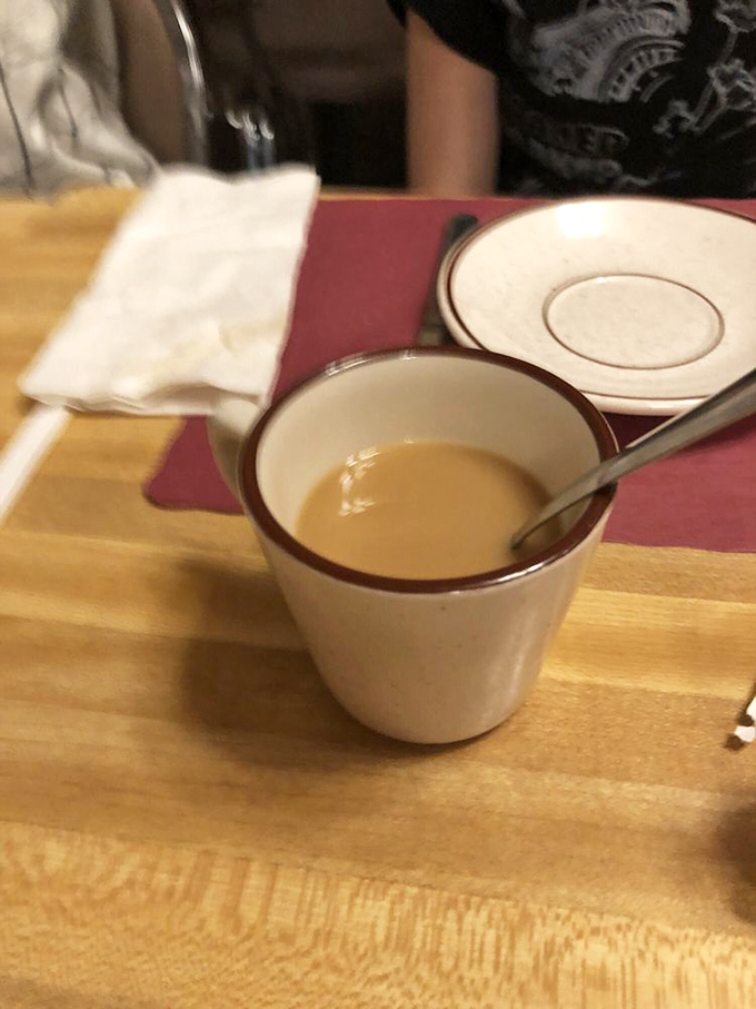 Coffee in a classic diner mug &ndash; the unsung hero of breakfast, promising warmth, caffeine, and unlimited refills of liquid motivation.