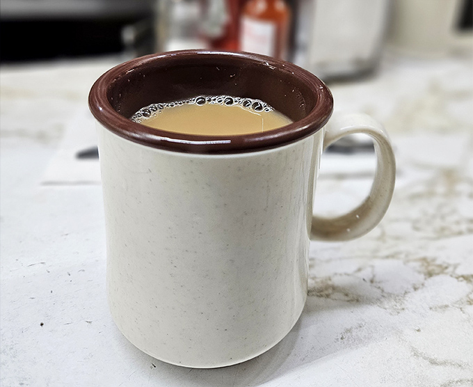 Coffee served in mugs that mean business. No fancy latte art here&mdash;just honest, hot coffee that's kept Detroit running for decades.