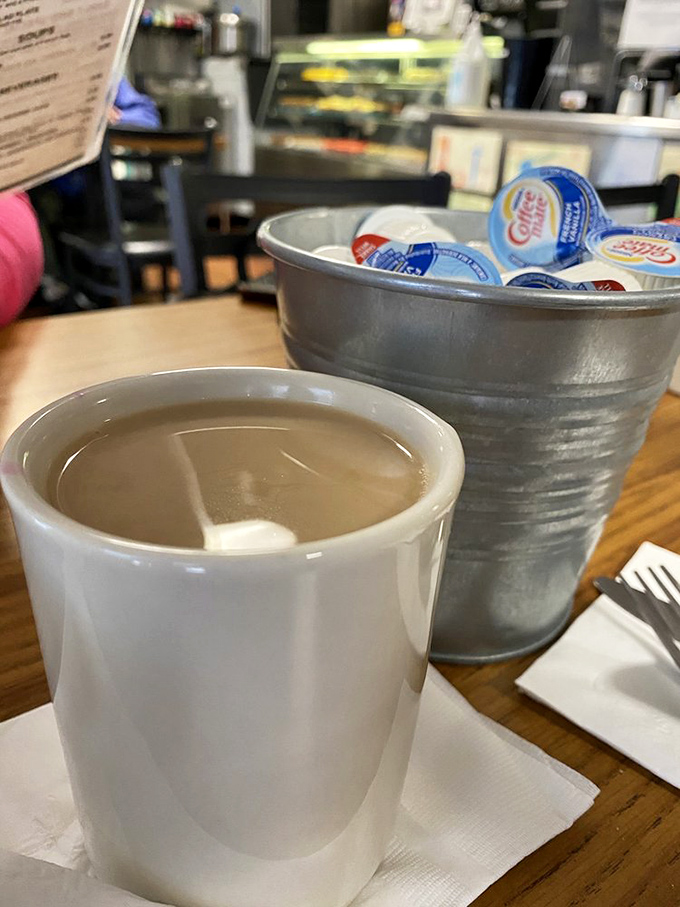 The world's problems seem slightly more manageable when viewed over the rim of this no-nonsense coffee mug. Refills are the true currency here.