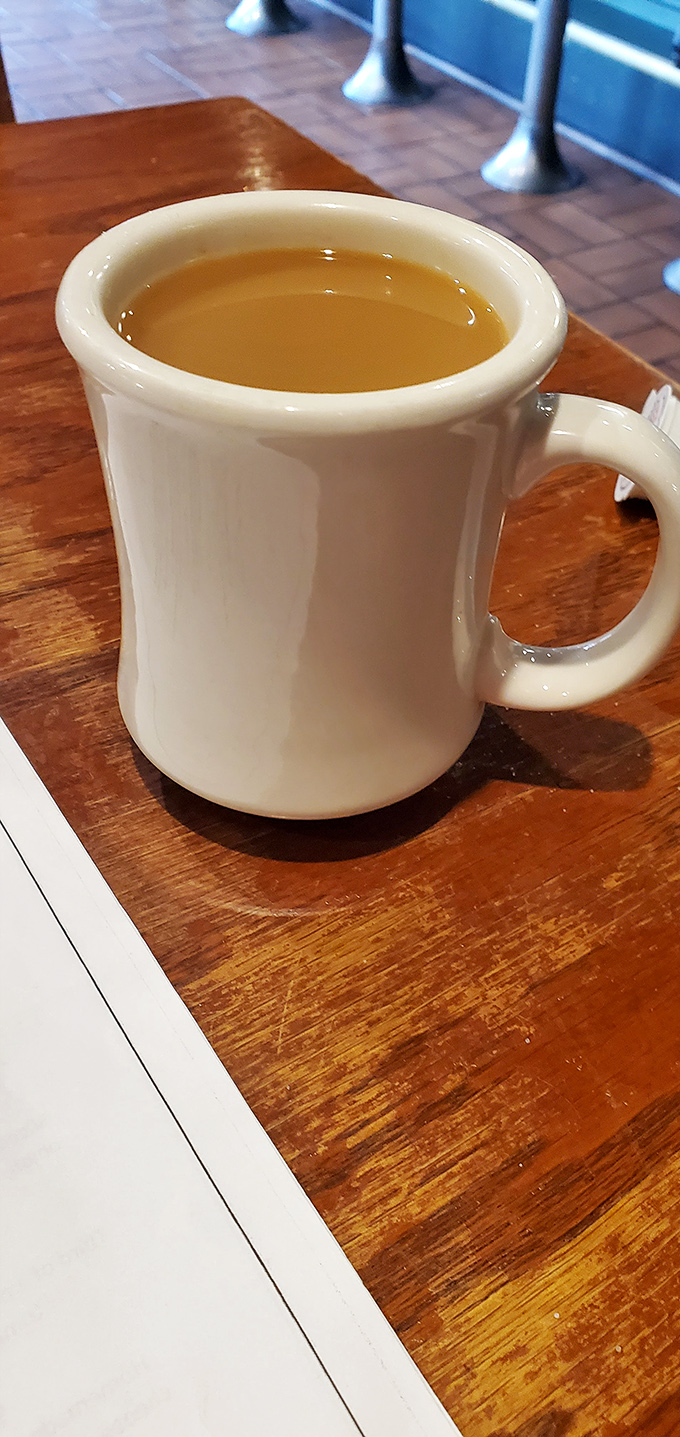 Coffee in a diner mug – the universal language of "take your time, the world can wait" served hot and without pretension.