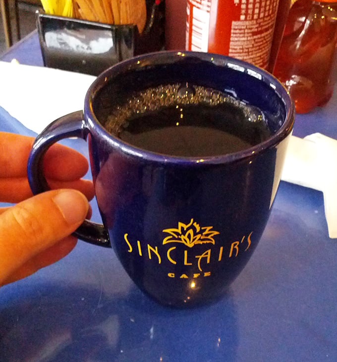 The navy blue coffee mug isn't just a vessel&mdash;it's a promise that what's inside will transform you from morning zombie to functioning human being. 