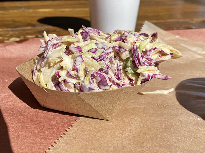 Purple and white cabbage transformed into creamy, crunchy coleslaw&mdash;the perfect cool counterpoint to all that smoky meat.