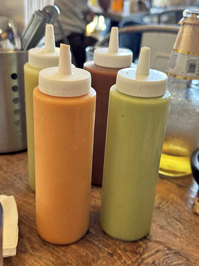 The sauce squadron stands ready for deployment&mdash;creamy orange chipotle and vibrant green salsa verde, each waiting to transform your taco experience.