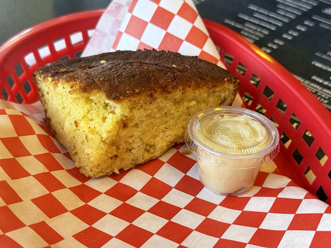 Golden cornbread with a side of honey butter. The yin to smoked meat's yang, and nobody's complaining.