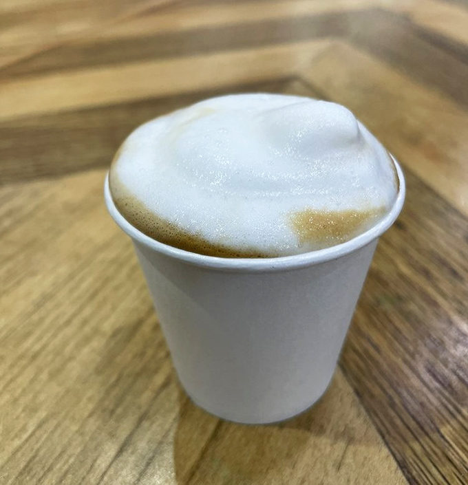 The cortadito's perfect foam cap sits like a cloud atop espresso heaven&mdash;proof that perfection sometimes comes in small packages.