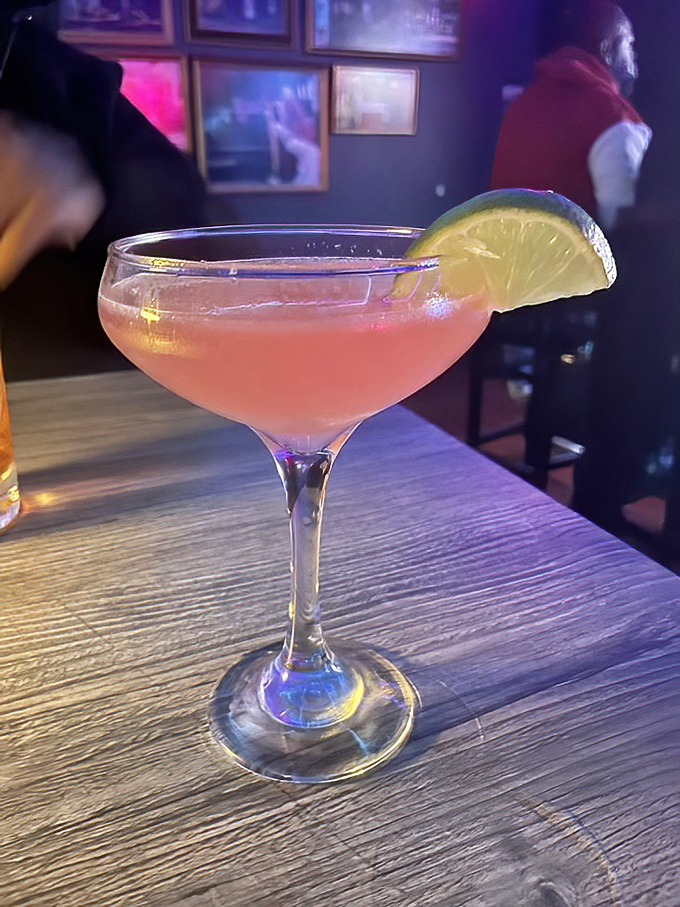 The pink cocktail that says, "Yes, you can be sophisticated while eating barbecue." That lime wedge isn't just garnish&mdash;it's setting boundaries.