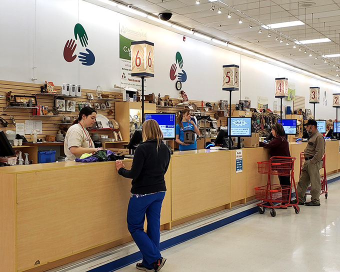 The checkout area buzzes with the quiet excitement of treasure hunters tallying their victories against retail inflation.