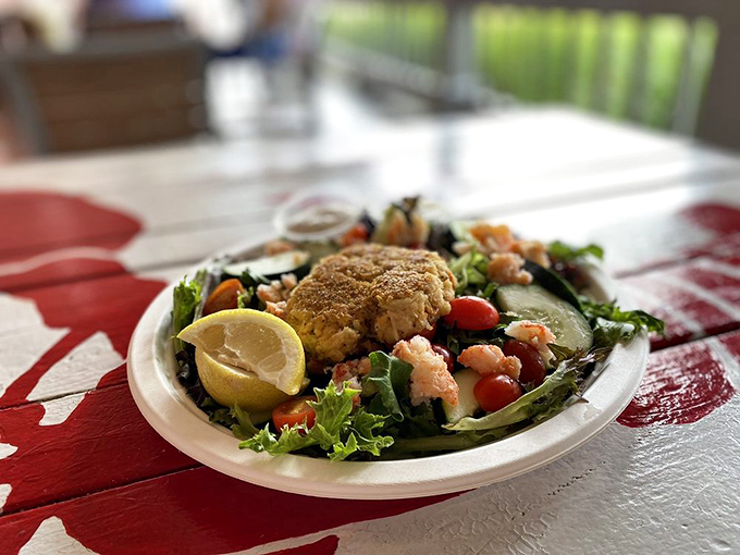 This isn't just a salad &ndash; it's a seafood celebration where fresh greens provide the perfect stage for that golden crab cake to shine.