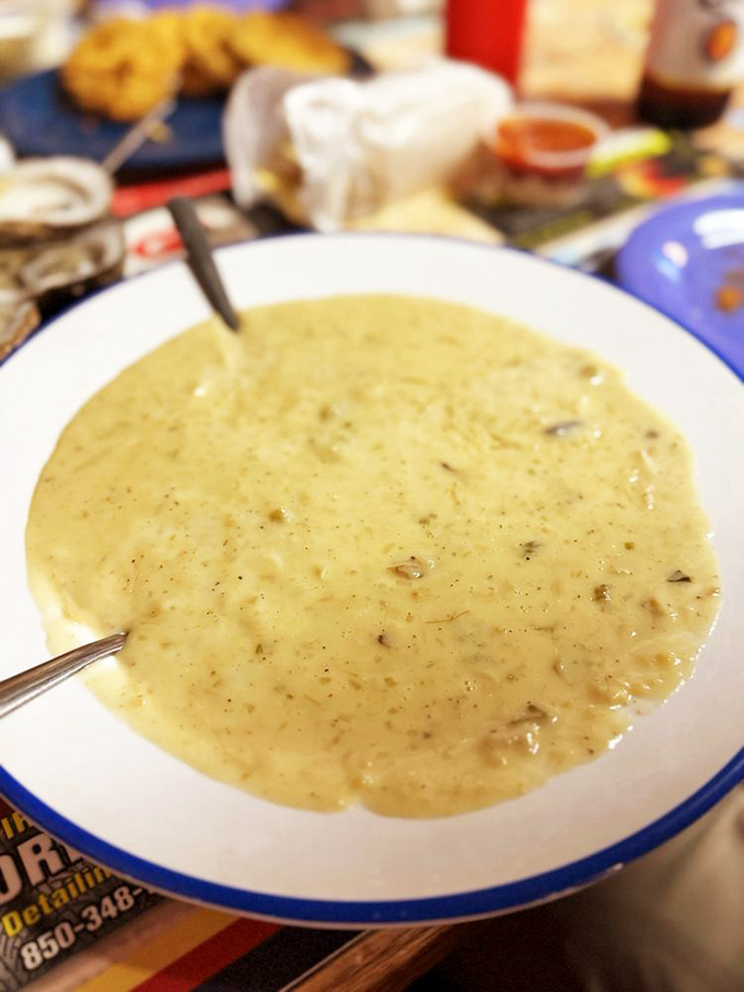 A bowl of creamy seafood chowder that doesn't need fancy garnishes to tell you it's packed with the essence of the ocean.