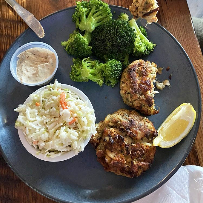 These golden-brown crab cakes with their perfect sear tell you the kitchen knows exactly what it's doing&mdash;minimal filler, maximum flavor.