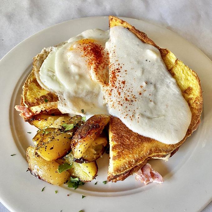 The Croque Madame&mdash;where ham and cheese transcend to art form under a blanket of b&eacute;chamel and a perfectly fried egg.