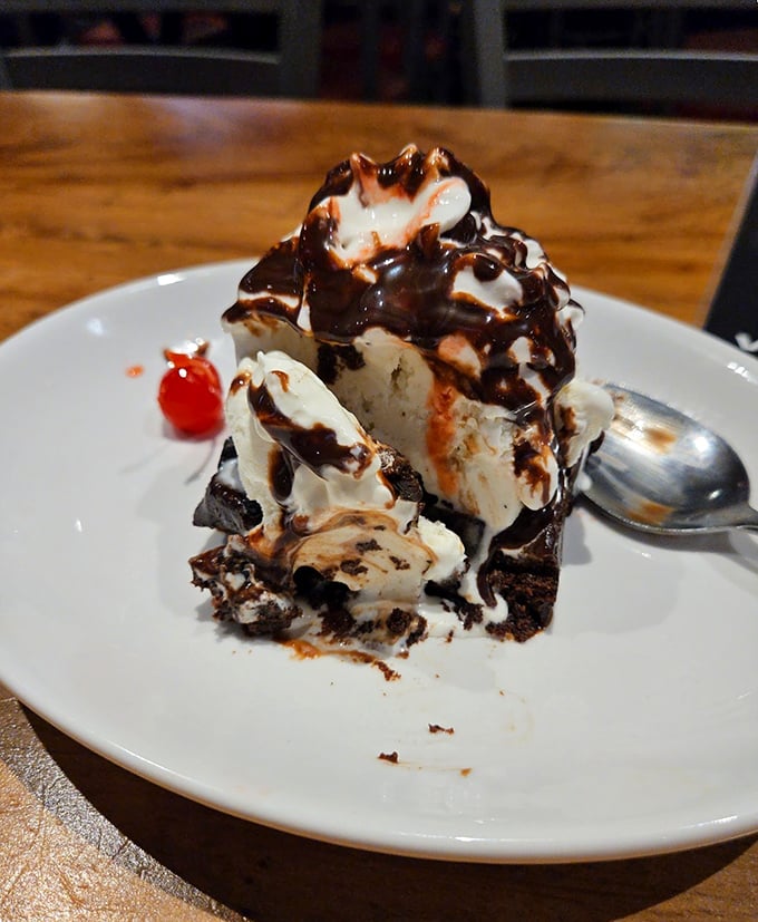 A dessert that doesn't know the meaning of restraint—chocolate, ice cream, and whipped cream in a tower of sweet rebellion.
