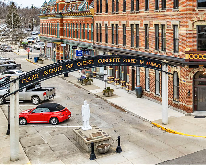 Downtown Bellefontaine's historic arch frames a street where 19th-century architecture meets 21st-century small business energy.