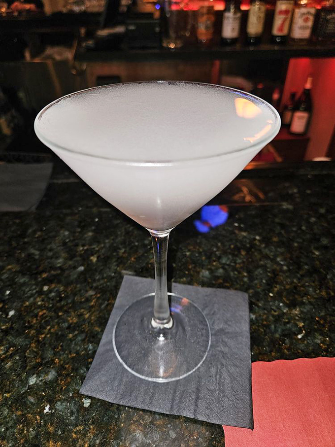 A perfectly chilled martini awaits its destiny at the bar &ndash; the liquid equivalent of a crisp white shirt in a world of graphic tees.