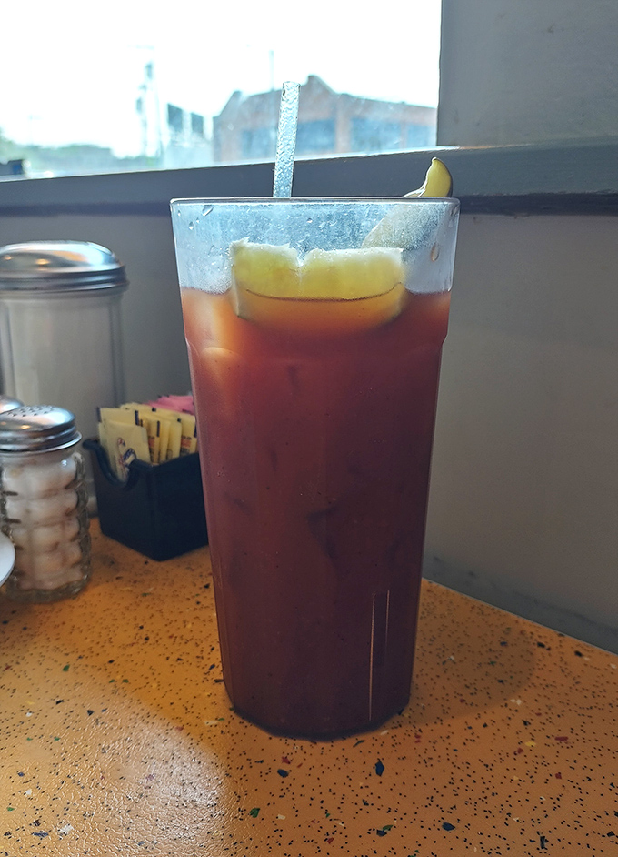 Iced tea served tall and strong, the perfect companion for tackling those towering deli sandwiches ahead.
