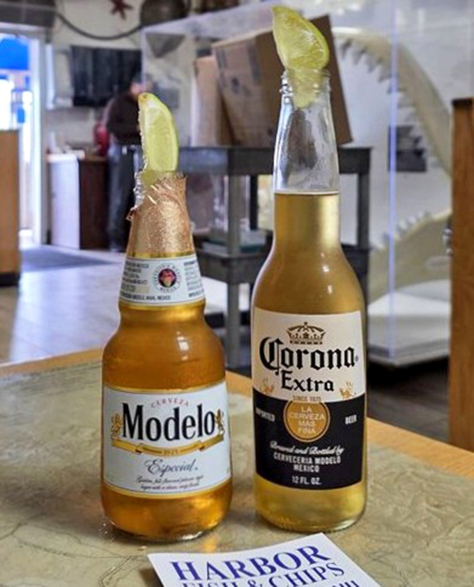 Cold cerveza with lime – the unofficial beverage department of coastal cuisine. These bottles have cooled more heated debates about sports than diplomats.