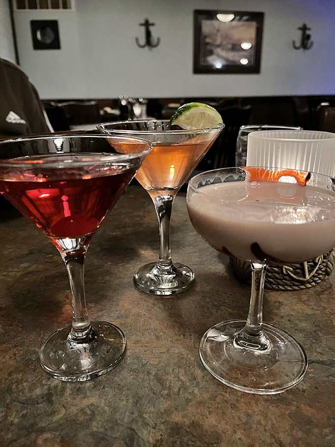 The cocktail trinity: one ruby red, one sunset gold, one creamy dream&mdash;each promising a different kind of evening ahead.