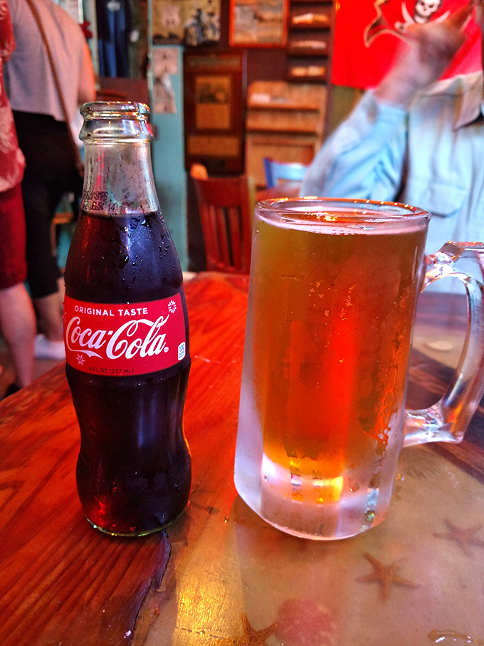 Cold Coca-Cola meets frosty beer mug—a pairing as timeless as Florida sunshine and afternoon thunderstorms.