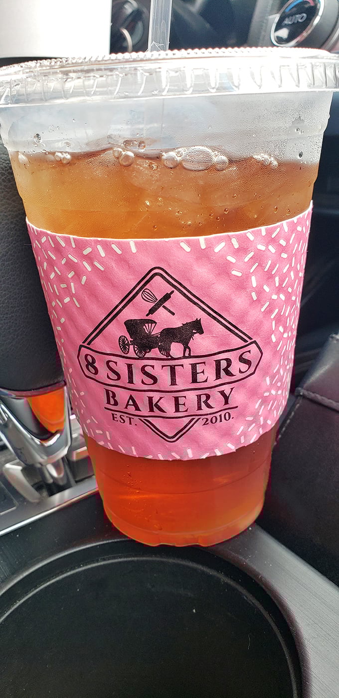 Their signature pink-wrapped iced tea&mdash;because after a donut pilgrimage, you need something to wash down the evidence of your splendid life choices.