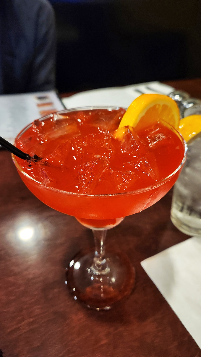 This vibrant cocktail isn't just a drink, it's a sunset in a glass—the perfect companion while you debate between fried or broiled for your main course.