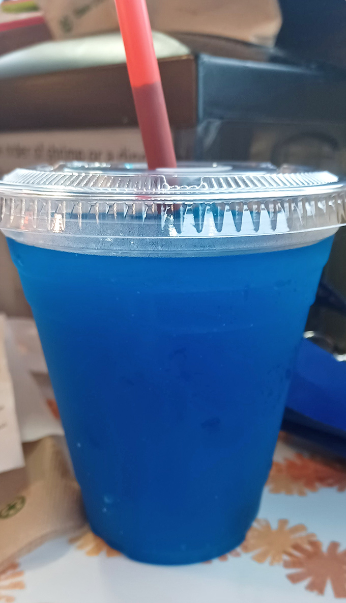 That electric blue drink isn't trying to be sophisticated&mdash;it's promising pure, unadulterated fun, like a swimming pool you can sip through a straw.