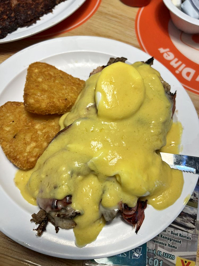 Eggs Benedict wearing its Hollandaise like a yellow satin cape. This breakfast superhero comes with crispy potatoes that could steal the show on their own.
