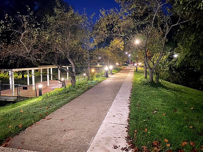 Night falls softly on Athens' park paths, where lampposts create pools of light guiding evening strollers through this Appalachian oasis.