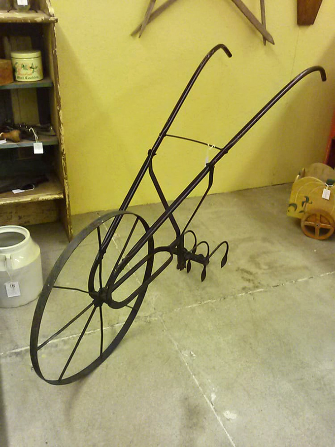 This vintage wheel cultivator isn't just farm equipment – it's industrial sculpture that tells the story of American agricultural ingenuity.