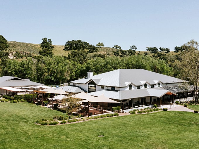 This sprawling wine country estate nestled against golden hills offers the kind of outdoor seating that makes you forget about indoor dining entirely.