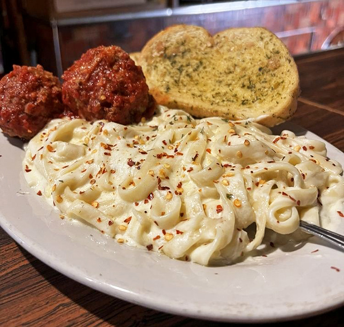 Fettuccine Alfredo that doesn't whisper "comfort food" &ndash; it belts it out like Pavarotti, with red pepper flakes providing the perfect high note to the creamy symphony. 