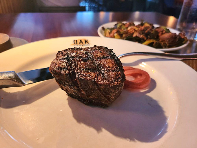 A filet mignon so perfectly seared it deserves its own spotlight. Minimalism at its most delicious.