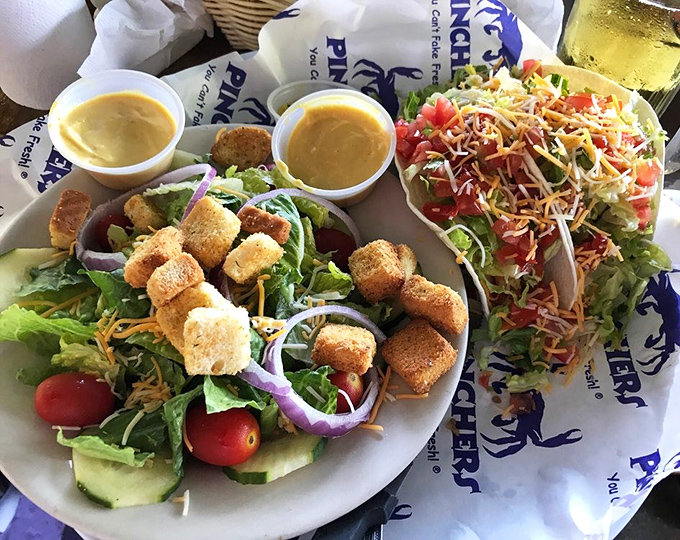 Two salads sharing a plate like old friends&mdash;one crisp and garden-fresh, the other vibrant with southwestern flair and topped with crunchy tortilla strips.