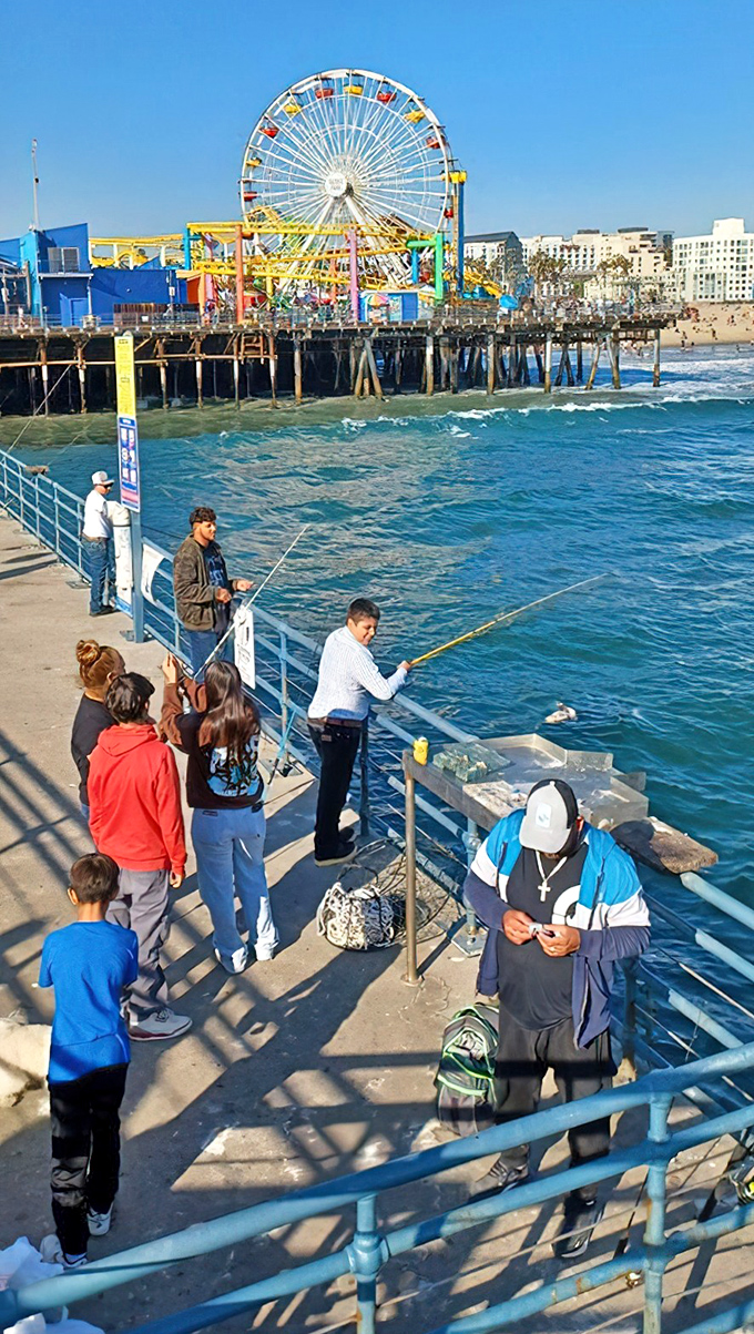 Fishing off the pier—where patience meets possibility. No fishing license required, just the willingness to believe the big one's coming.