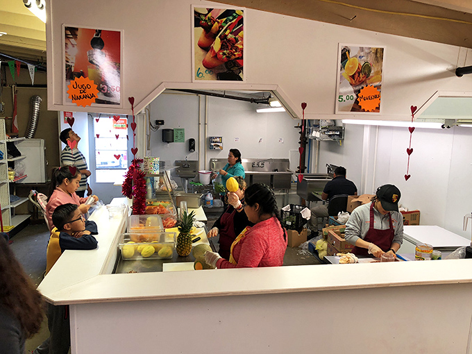 This isn't just a food stall&mdash;it's a portal to another country. Those fruit cups are edible passports to somewhere sunnier and more delicious.