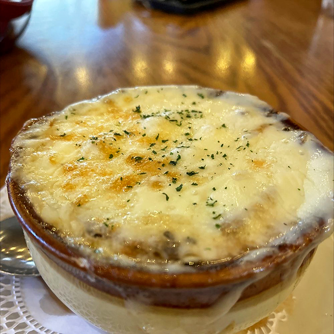 French onion soup with a cheese cap so perfect it deserves its own Instagram account. Bubbling, golden, and worth every delicious spoonful.