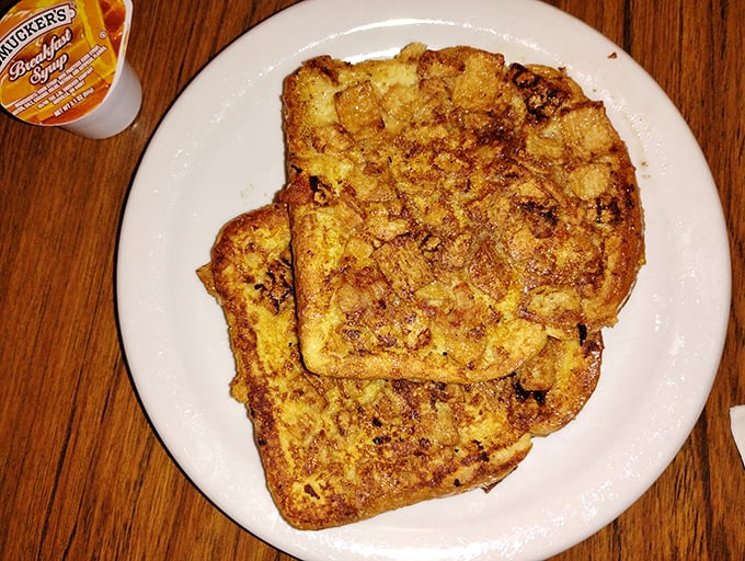 French toast that's achieved the impossible balance &ndash; crispy edges giving way to a custardy center that makes you question all other breakfast choices.