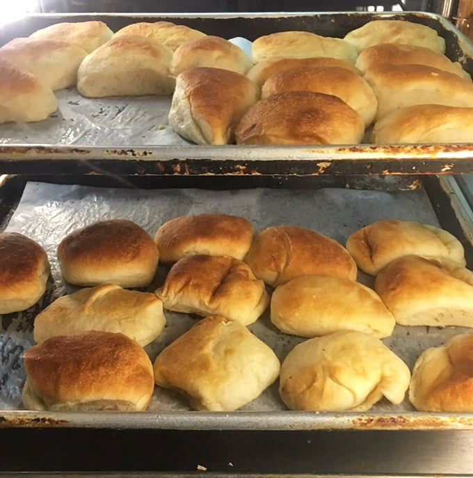 Fresh-baked rolls lined up like golden soldiers, ready to sacrifice themselves for the noble cause of sopping up every last drop of gravy.