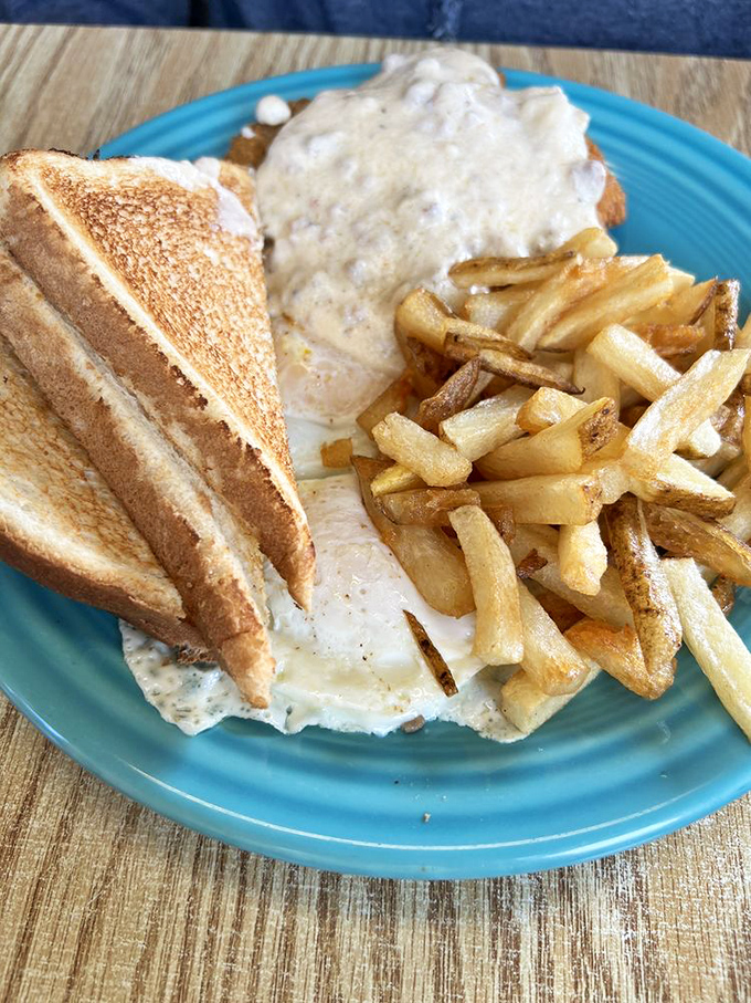 Country fried steak smothered in gravy with eggs on top&mdash;because sometimes breakfast should be wearing a cowboy hat and boots. 