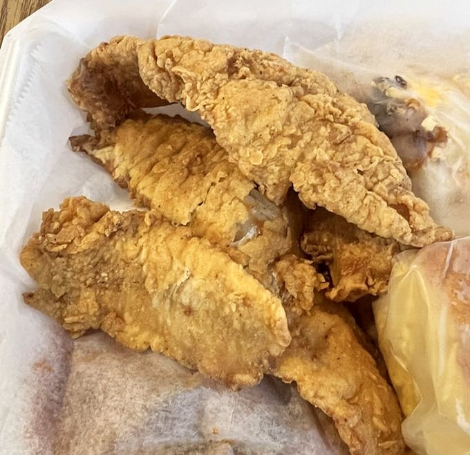 Fried whiting so perfectly golden it belongs in Fort Knox, with a crust that shatters like your willpower when dieting.