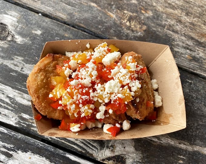 These aren't just fried green tomatoes&mdash;they're little Southern discs of joy, topped with a colorful medley of peppers and crumbled cheese.