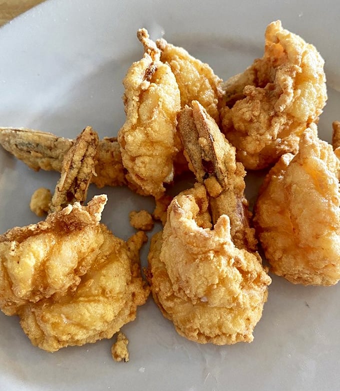 These golden-battered shrimp aren't just fried&mdash;they're transformed into crunchy vessels of oceanic delight that disappear faster than you'd expect.
