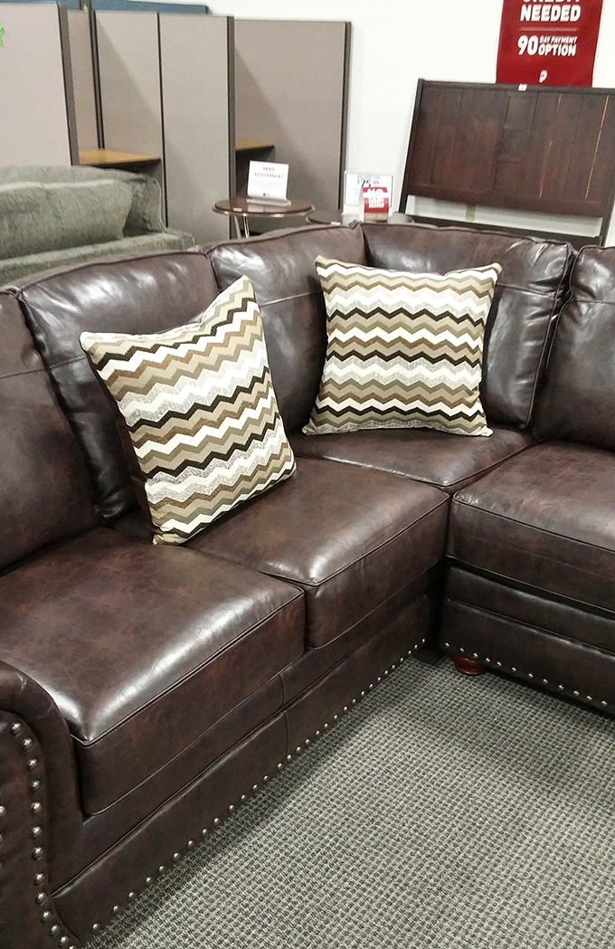 That leather sectional has seen some Netflix marathons in its day, but it's ready for your living room redemption story.