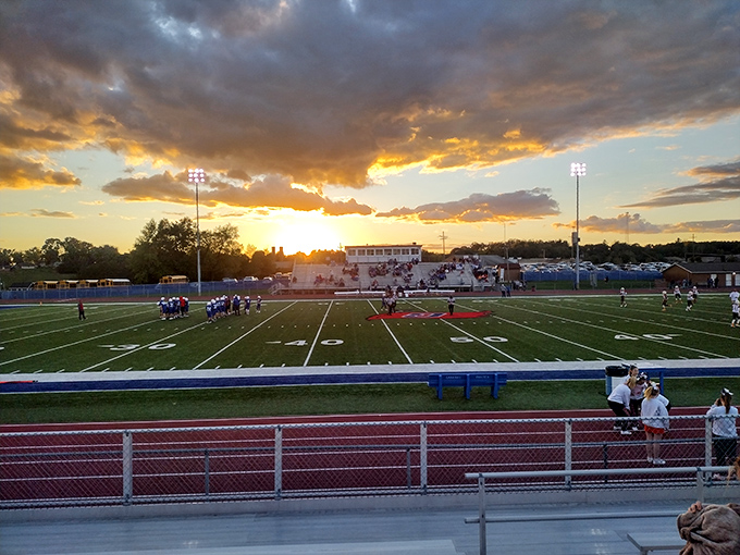 Friday night lights shine over Garaway's field as the sun sets. Even in small-town America, few things rival the magic of high school football under a golden sky.