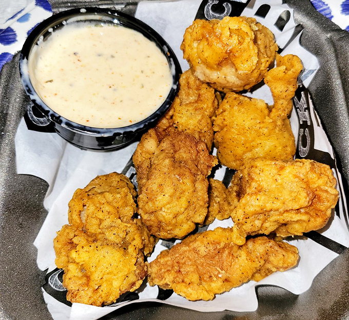 Crispy golden nuggets nestled among fries and pulled meat&mdash;proof that sometimes the best things in life come in unexpected packages.